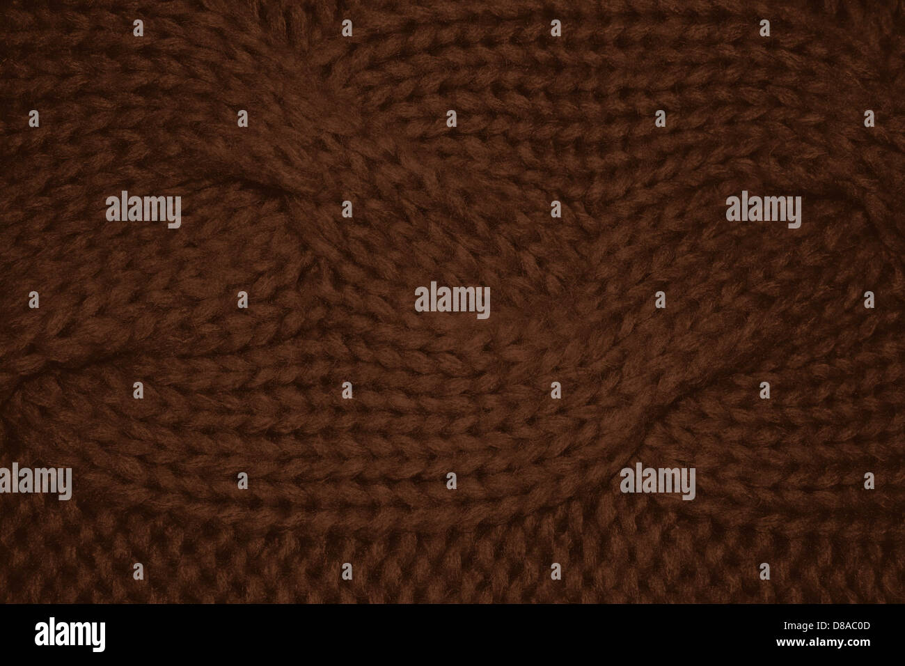 A close-up of a brown cable knit pattern, showcasing the detailed ...