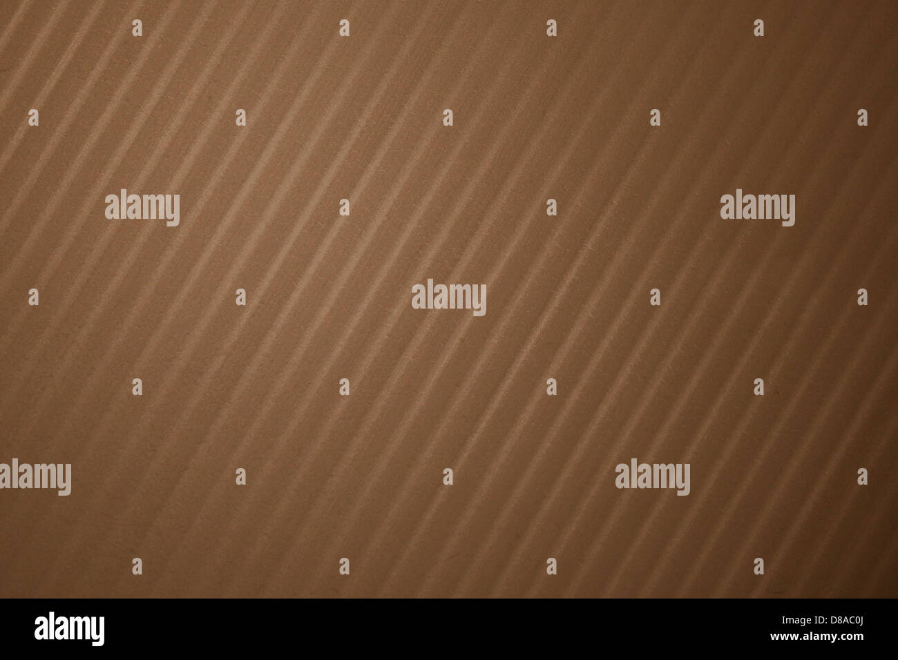 A close-up view of brown plastic with a diagonal striped texture. The ...