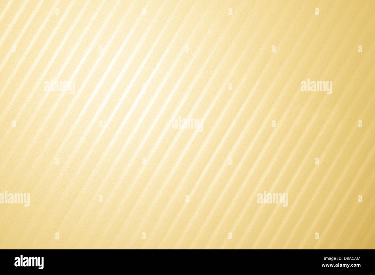 A close-up view of butterscotch-colored plastic with a diagonal striped ...