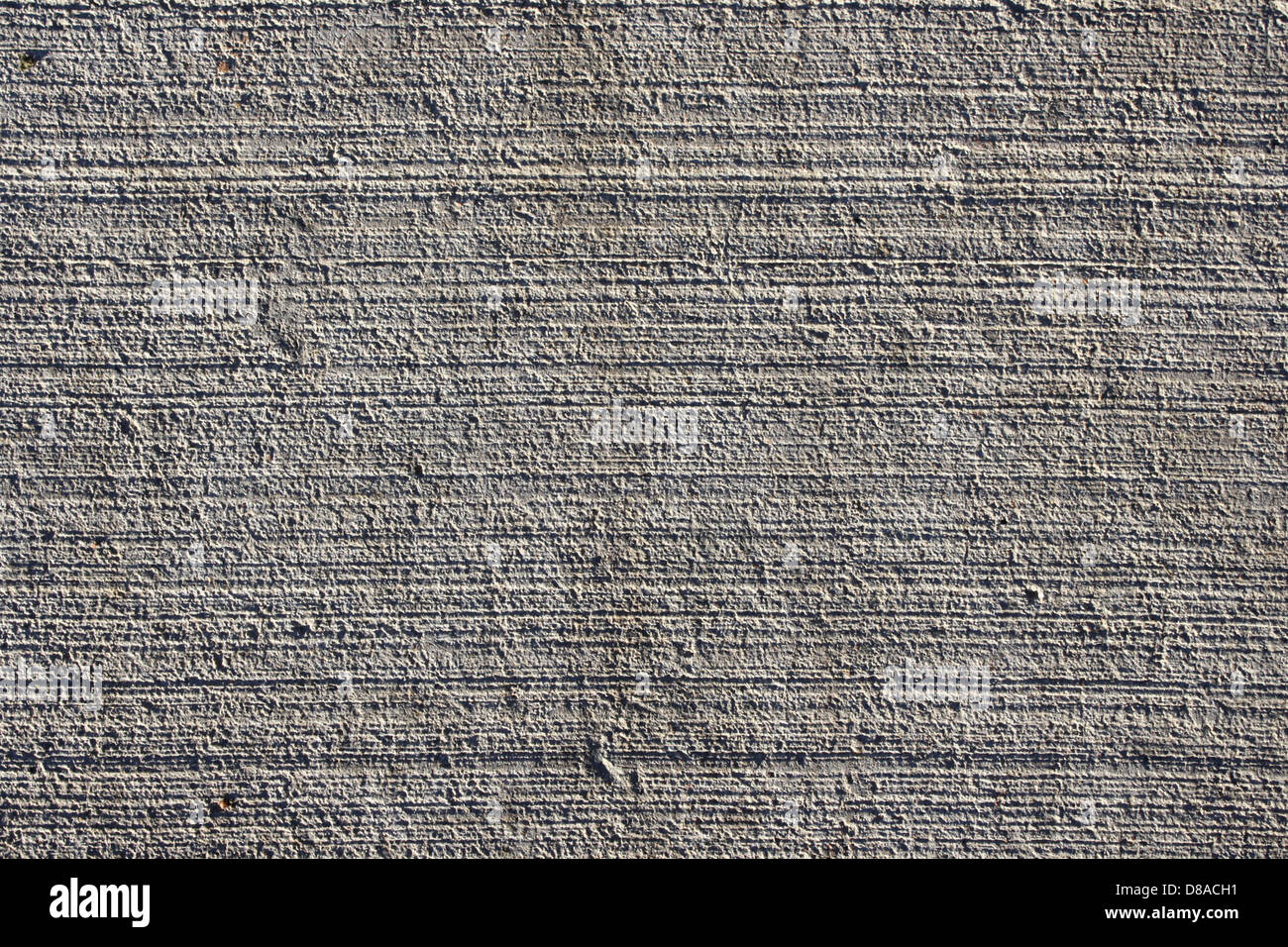 A detailed close-up of cement texture, featuring its rough and gritty ...