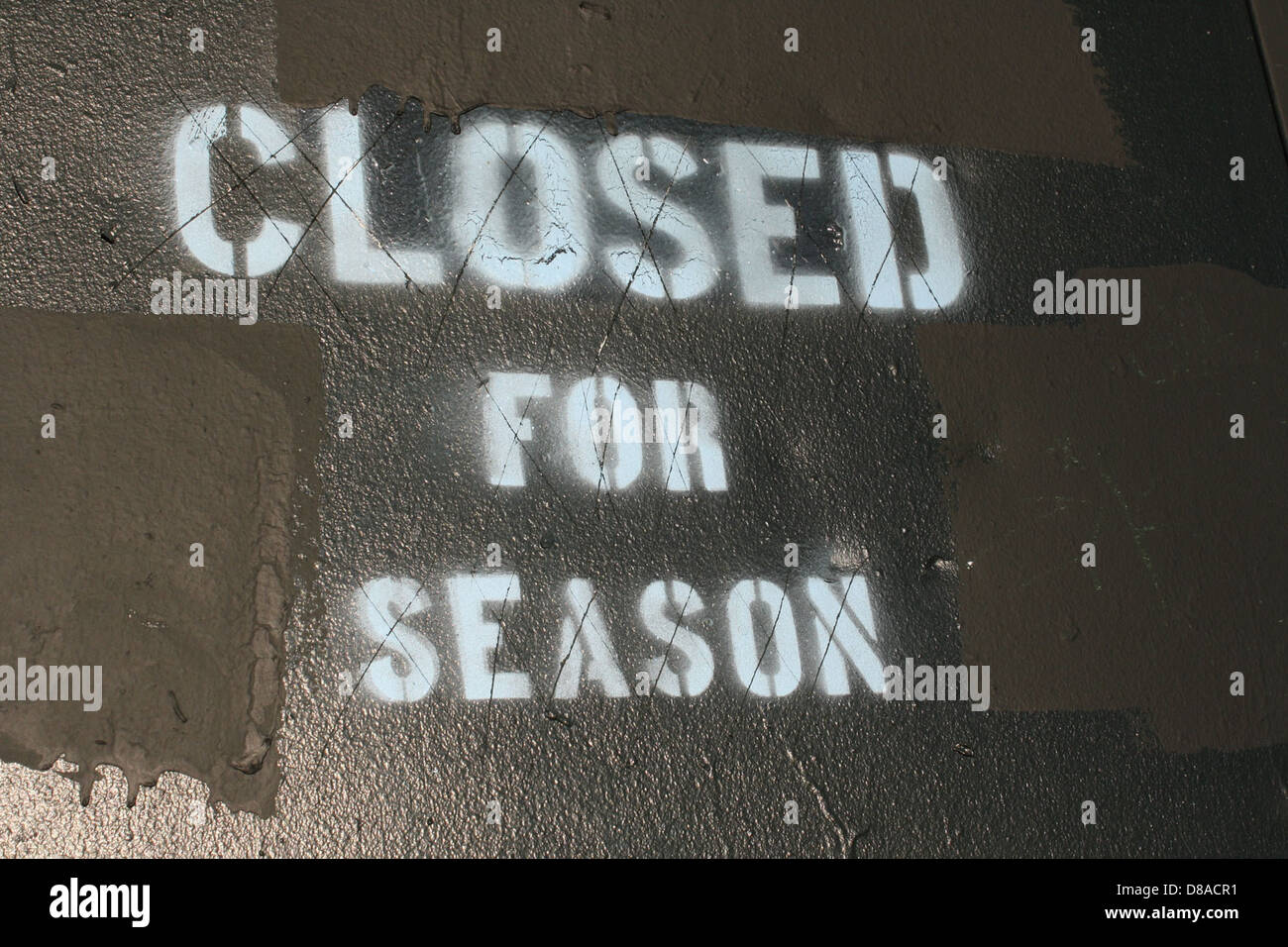 A sign reading 'Closed for Season' outside a business or tourist ...