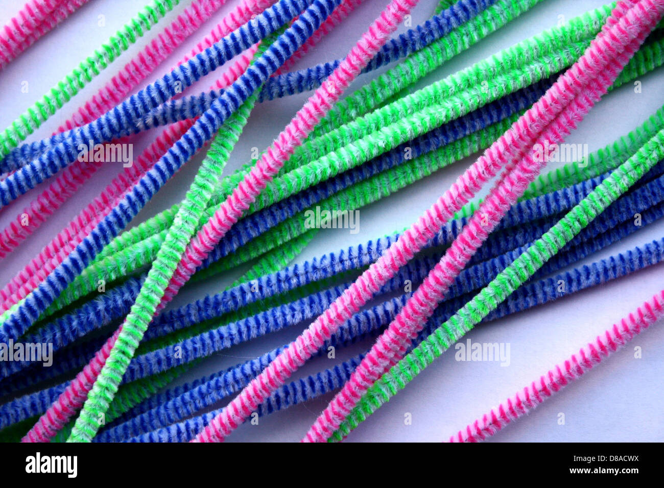 This image features a collection of colorful pipe cleaners, commonly ...