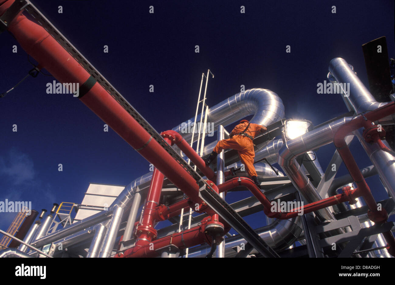Worker inspects pipeline at offshore petroleum platform from Petrobras ...