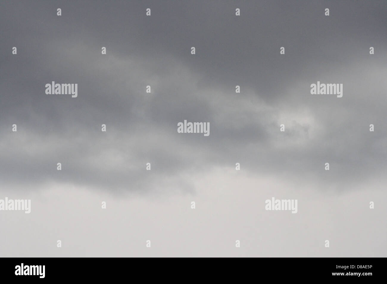 A dull, gray overcast sky stretches across the horizon, indicating a ...