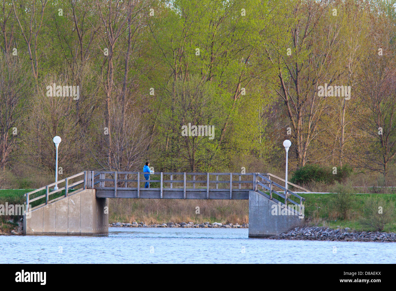 Women on bridge looking into the distance Stock Photo - Alamy