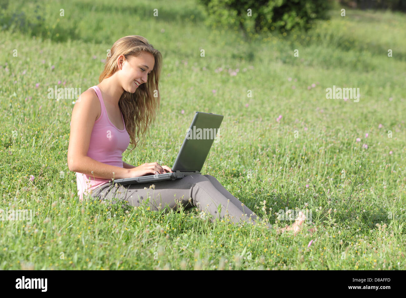 Barefoot girl laptop hi-res stock photography and images - Alamy