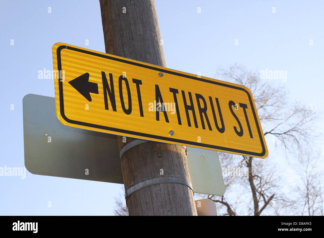 A traffic sign indicating that the street is not a thru street, meaning ...