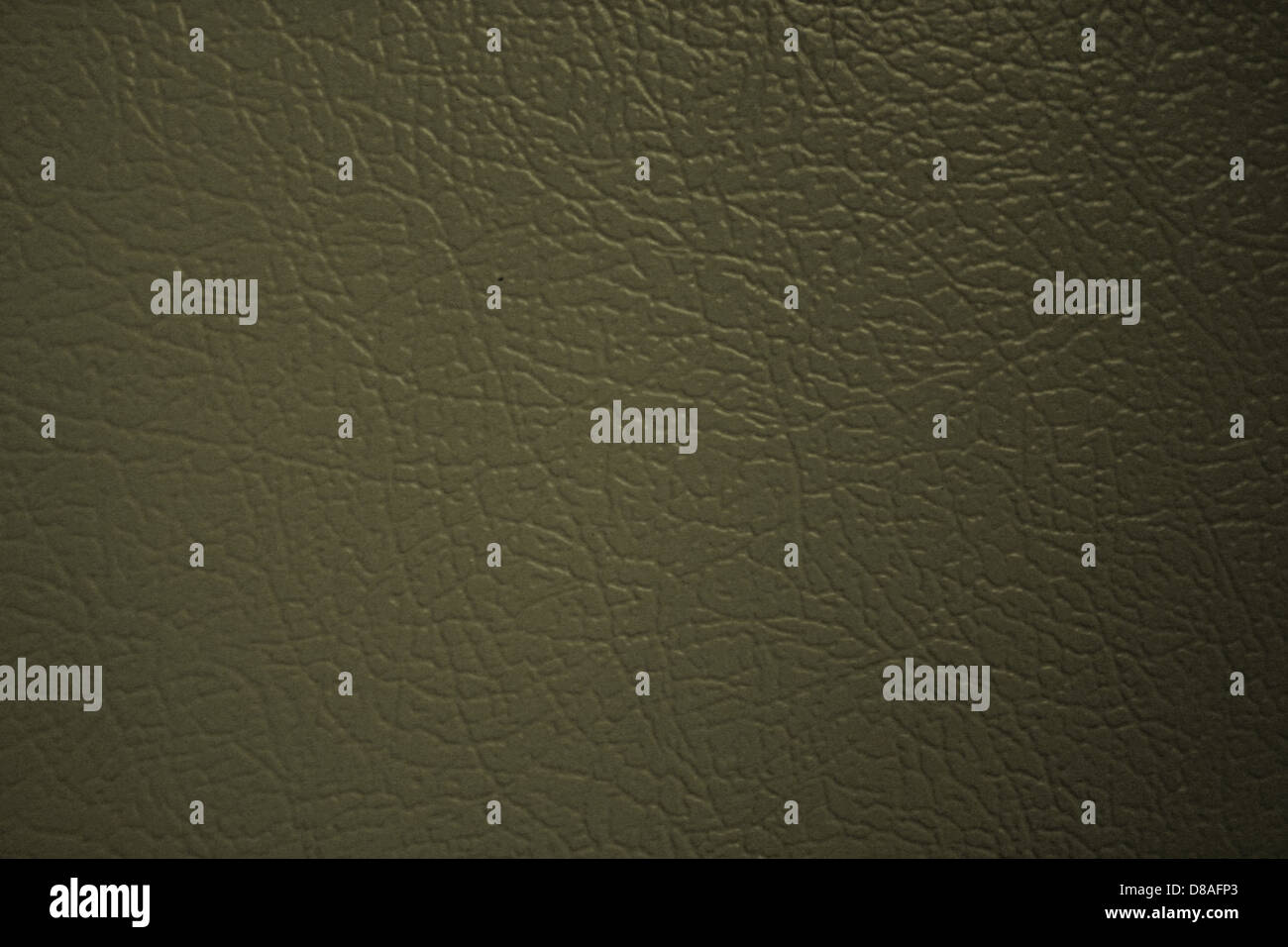A detailed image showing the texture of olive green faux leather ...