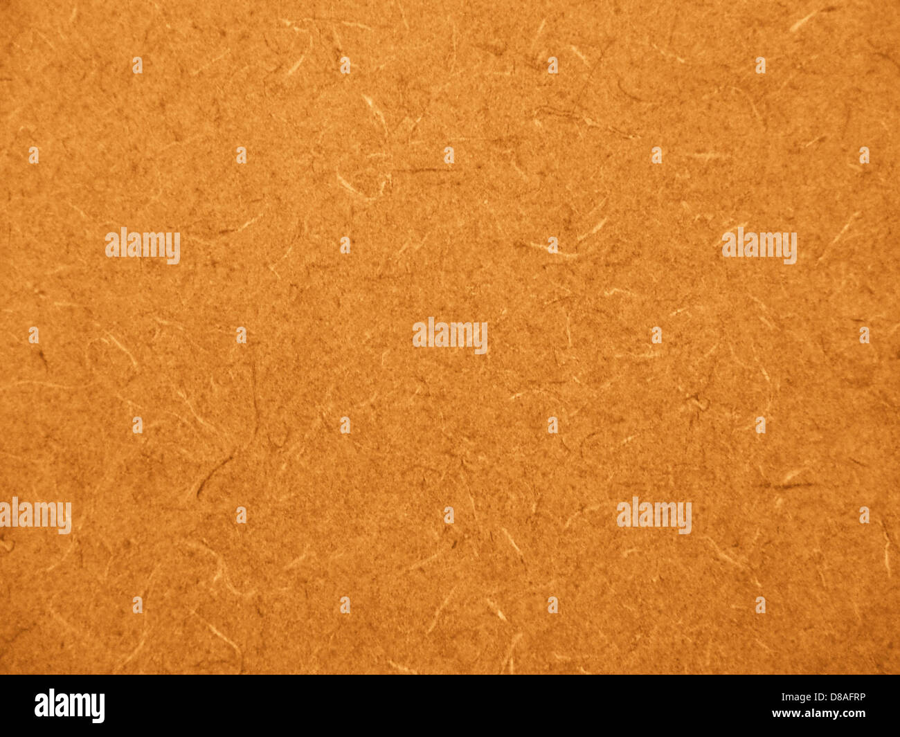 A close-up image of a laminate countertop featuring an orange abstract ...