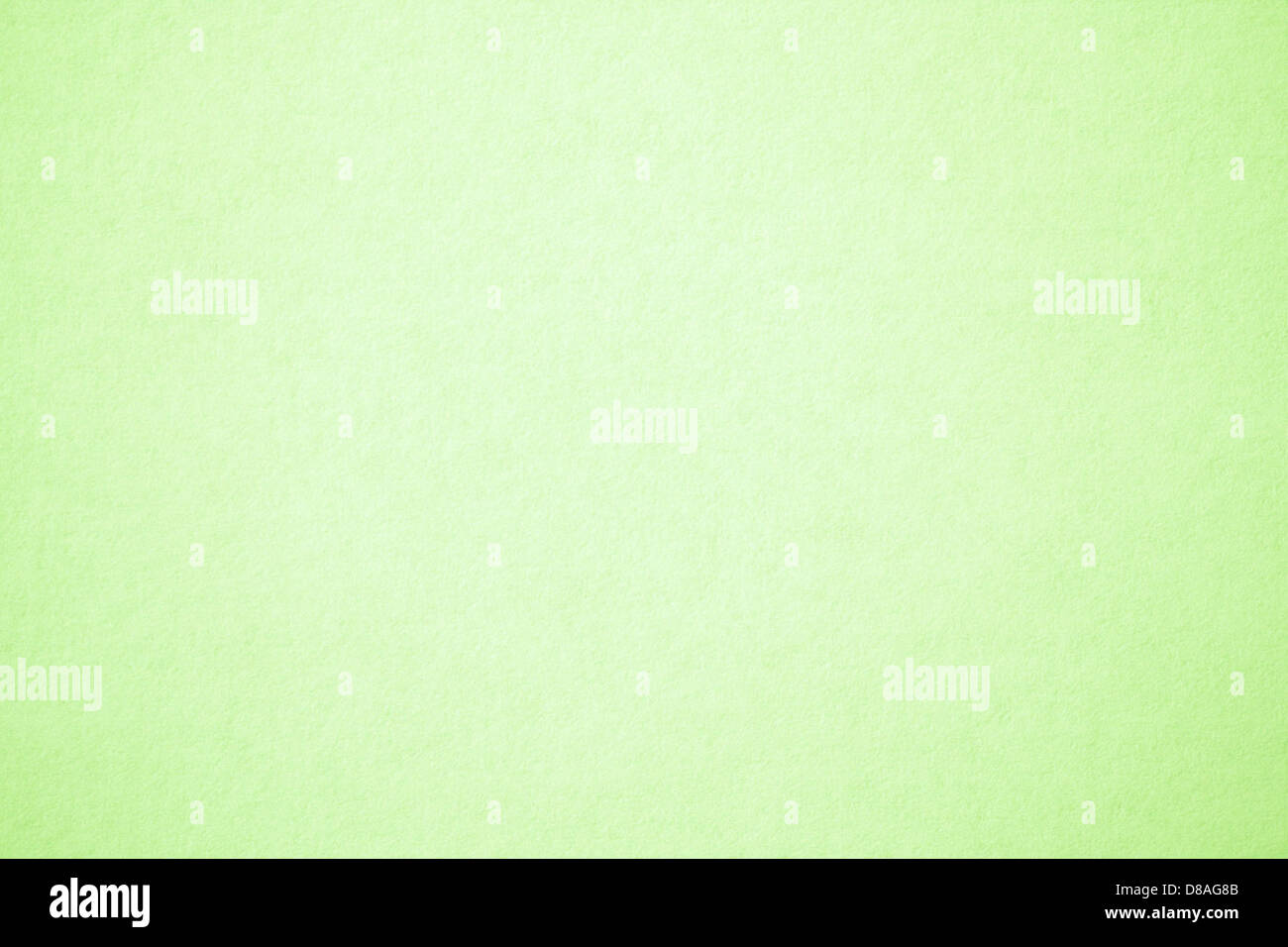 A smooth pastel green paper texture is shown, with the soft, even color ...