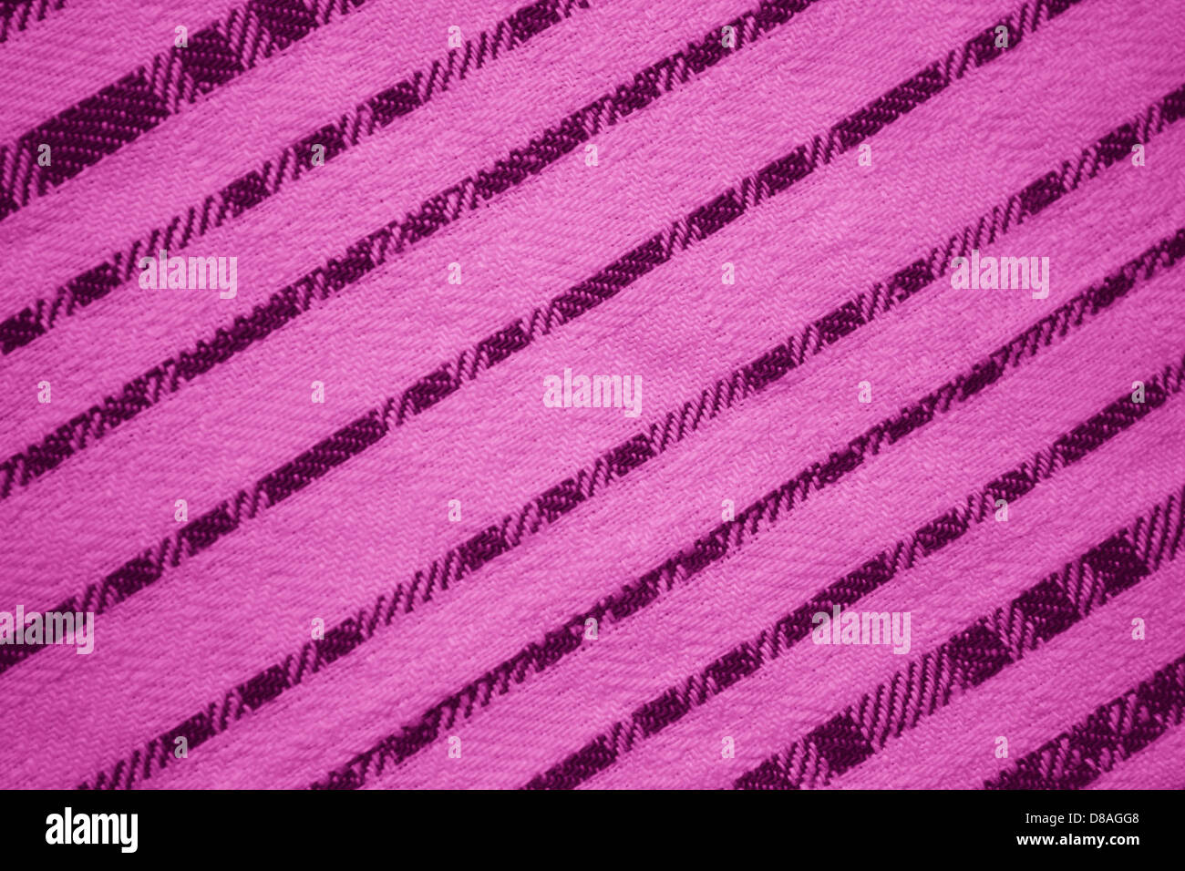 A fabric featuring diagonal pink stripes, creating a modern and stylish ...