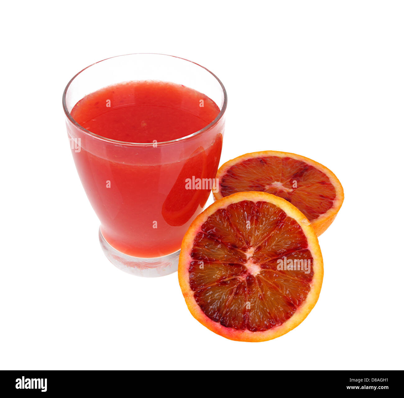 Red orange juice in a glass and oranges Stock Photo - Alamy