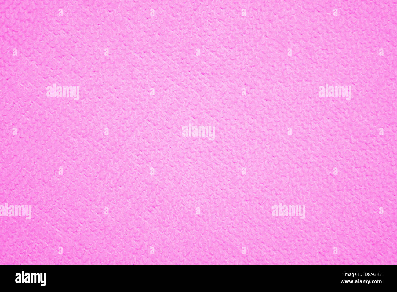 A close-up view of a pink microfiber cloth, highlighting its soft ...