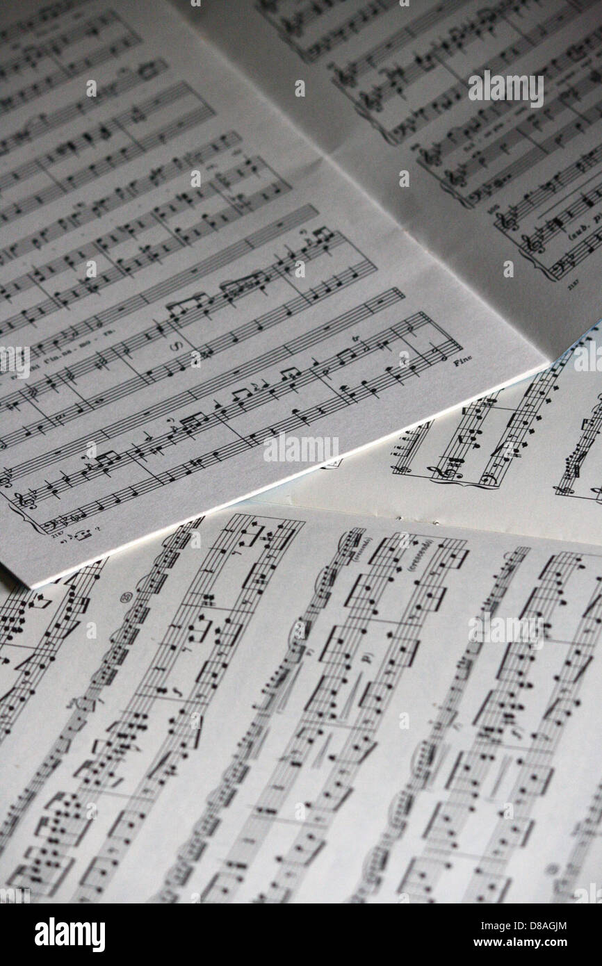 A printed sheet of music, showcasing musical notes and symbols. This ...