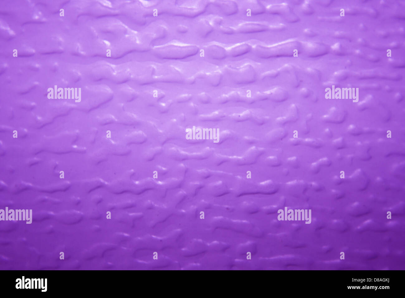 A detailed image of purple plastic with a bumpy texture, showcasing its ...