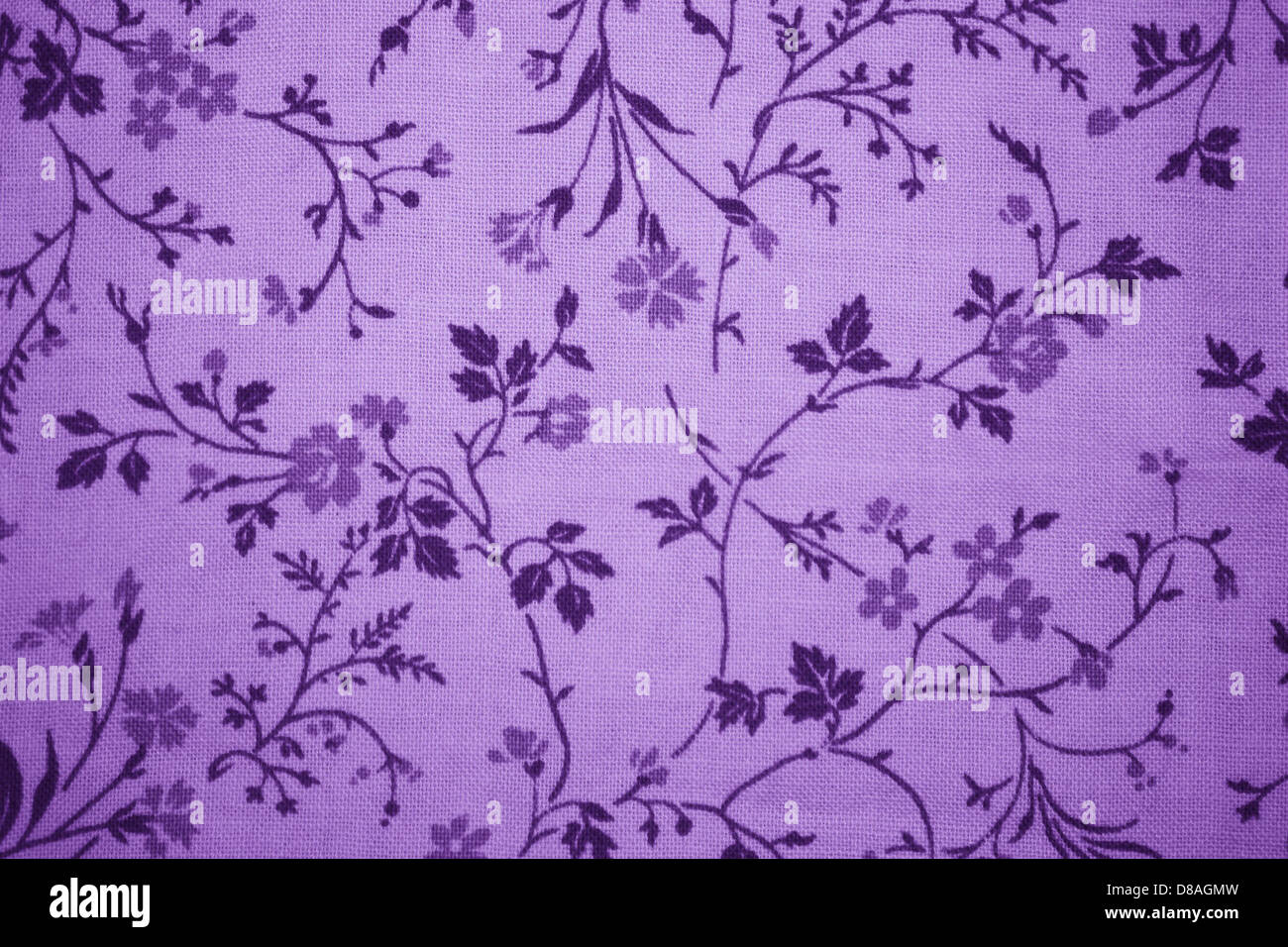This stock photo shows a close-up view of purple floral print fabric ...