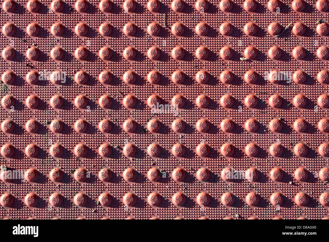 red non skid surface from sidewalk ramp texture Stock Photo - Alamy