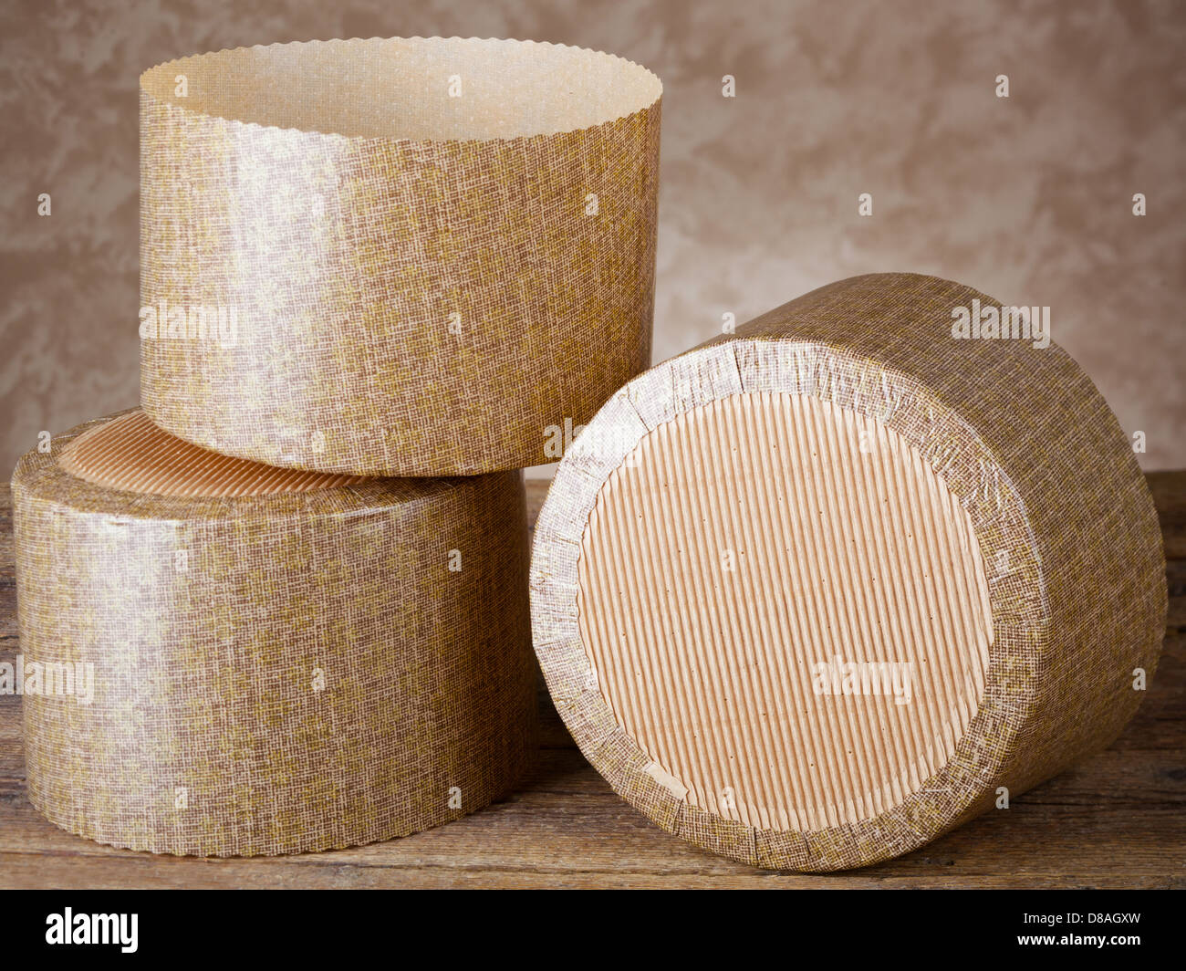 Paper molds for panettone on wooden table Stock Photo - Alamy