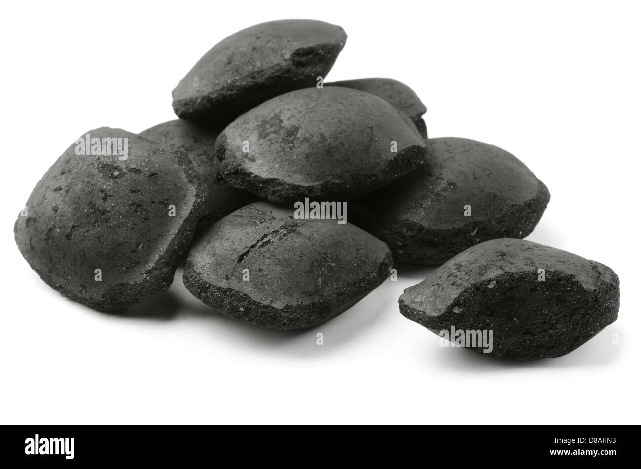 Coco charcoal briquetts isolated on white Stock Photo - Alamy