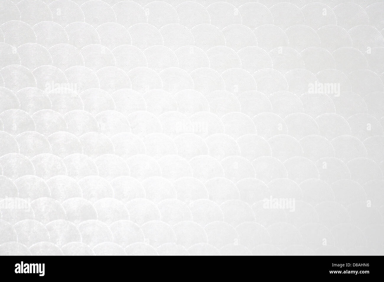 A close-up of a white plastic texture with circular patterns ...