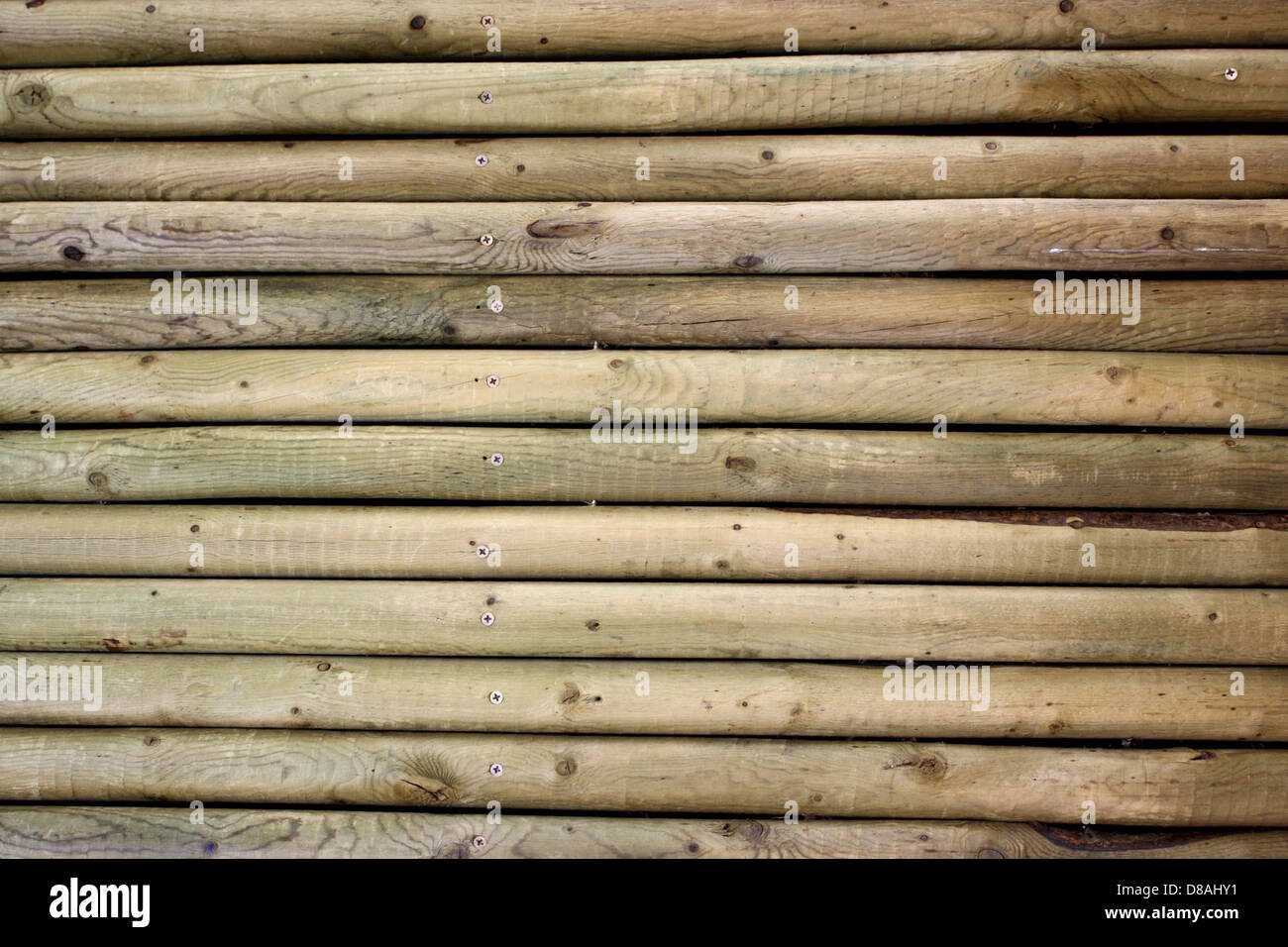 A close-up view of wooden poles, highlighting the natural grain and ...