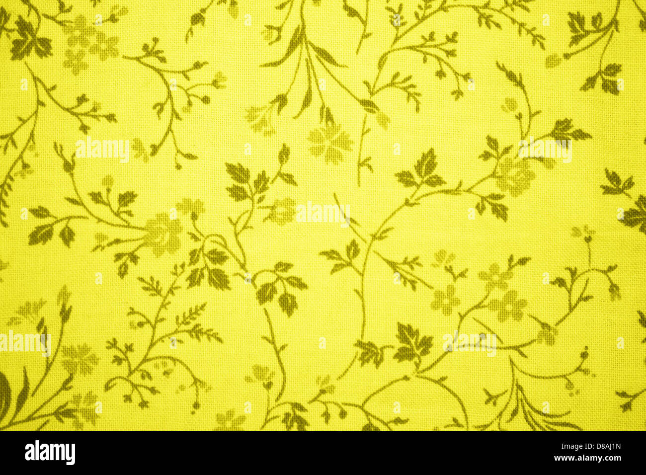This stock photo features a close-up view of yellow floral print fabric ...