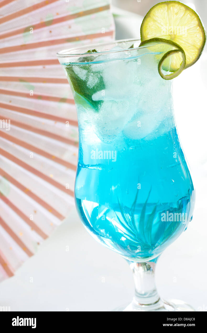 Blue drink cocktail with ice and lemon Stock Photo - Alamy