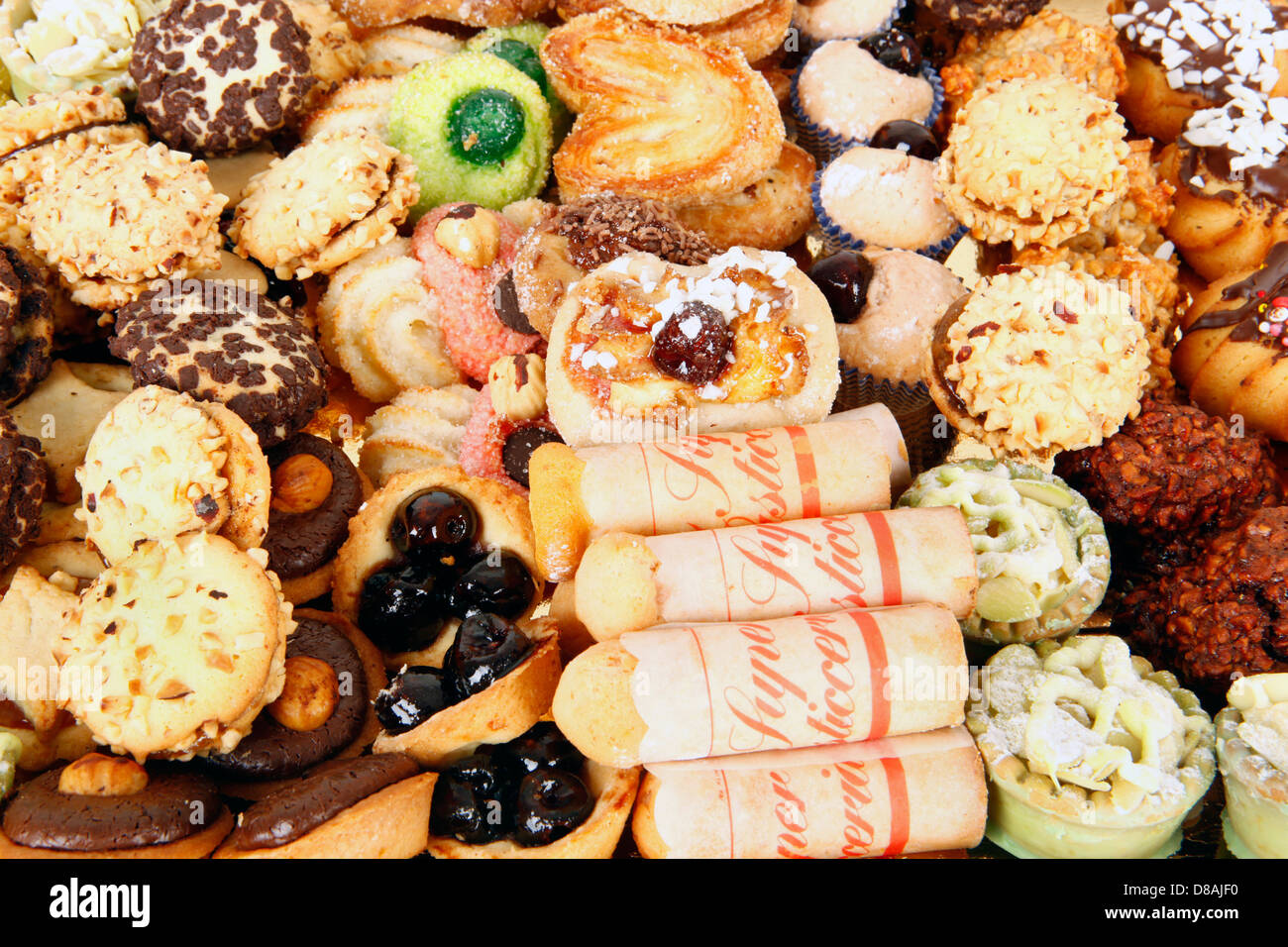 Sweet pastries on white background Stock Photo - Alamy