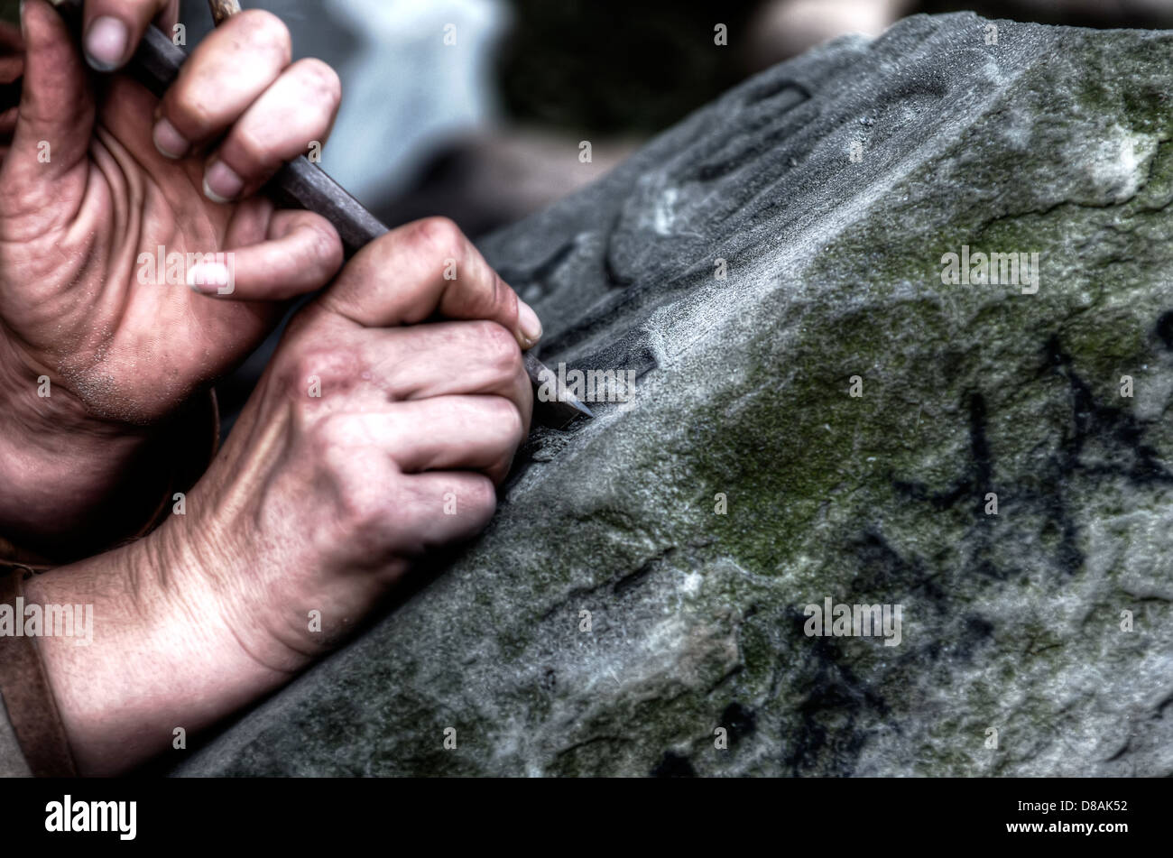Detail of a woman carving stone with medieval tool Stock Photo - Alamy