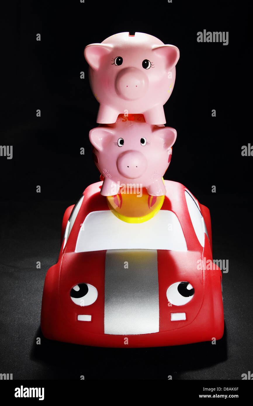 Piggy Banks on Toy Car Stock Photo - Alamy