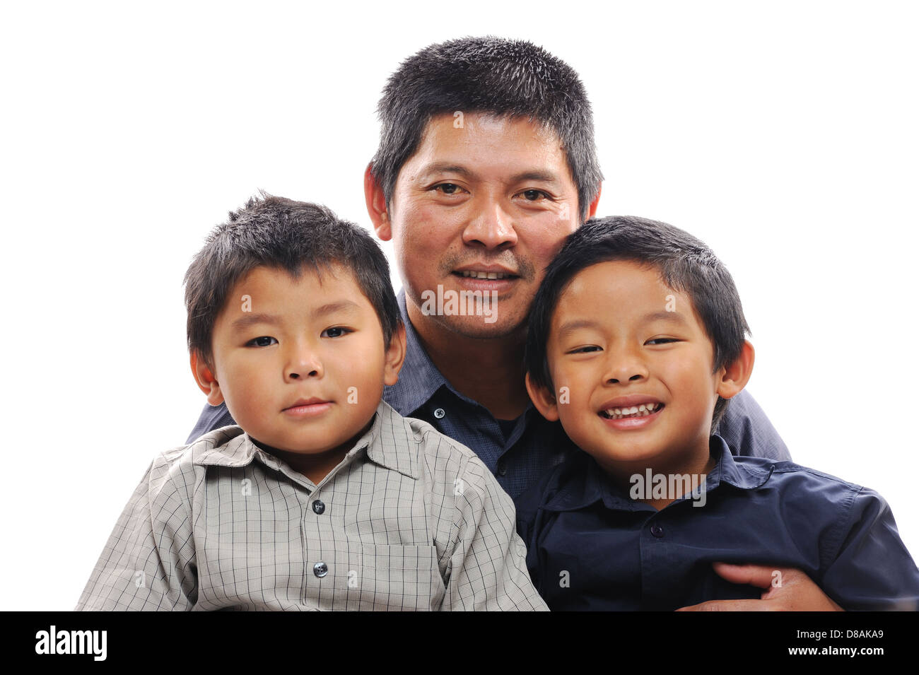 Asian father cuddles sons looking happy Stock Photo - Alamy