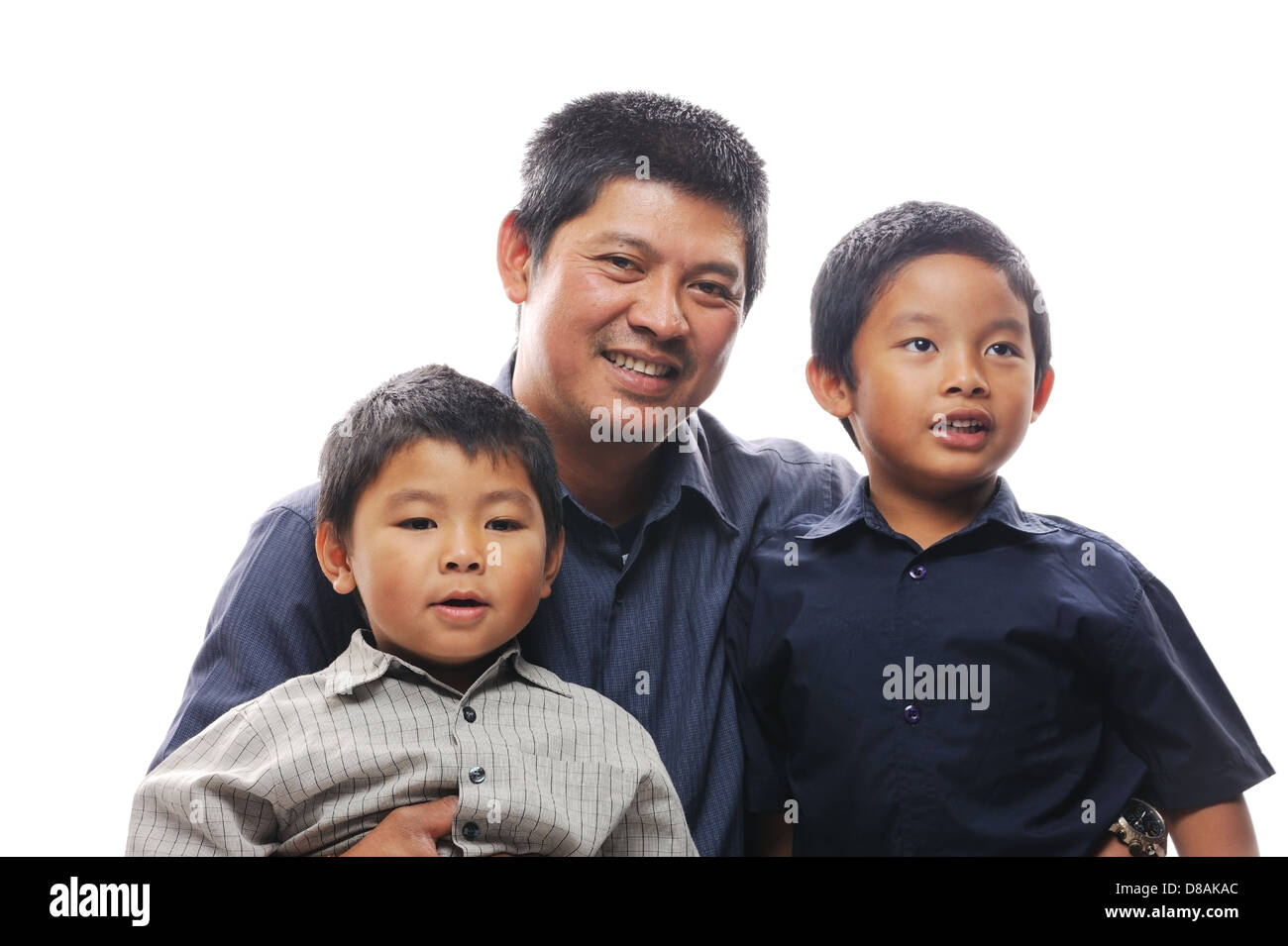 Smiling asian father with two sons in front of isolated background ...