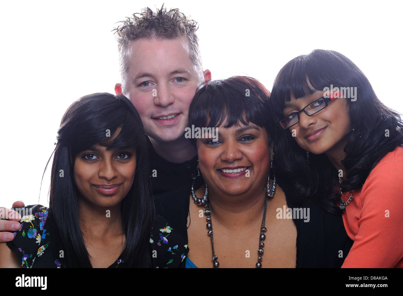 Happy and smiling multiracial family in front of isolated background ...