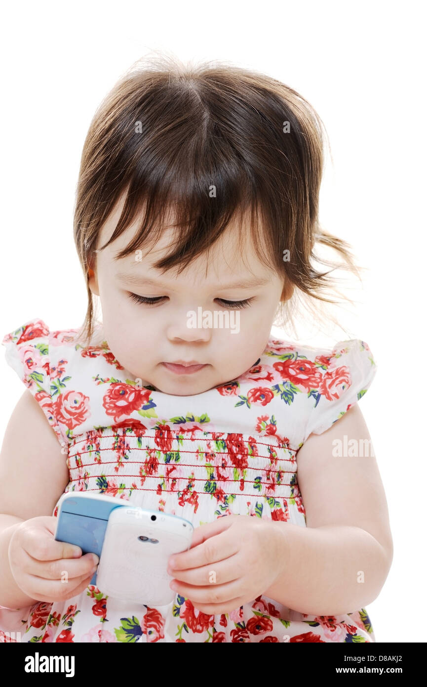 Young infant girl playing with mobile phone Stock Photo - Alamy