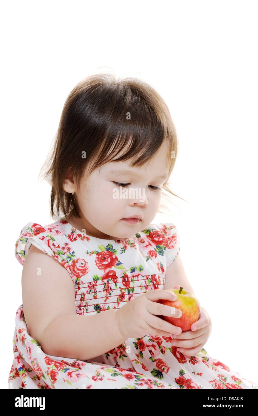 Infant girl holding her first apple Stock Photo - Alamy