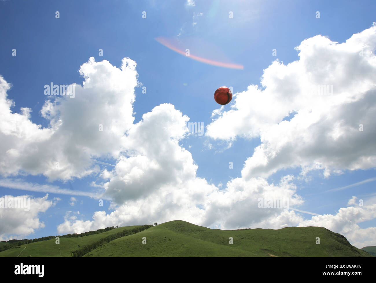 A football flying in the sky Stock Photo - Alamy