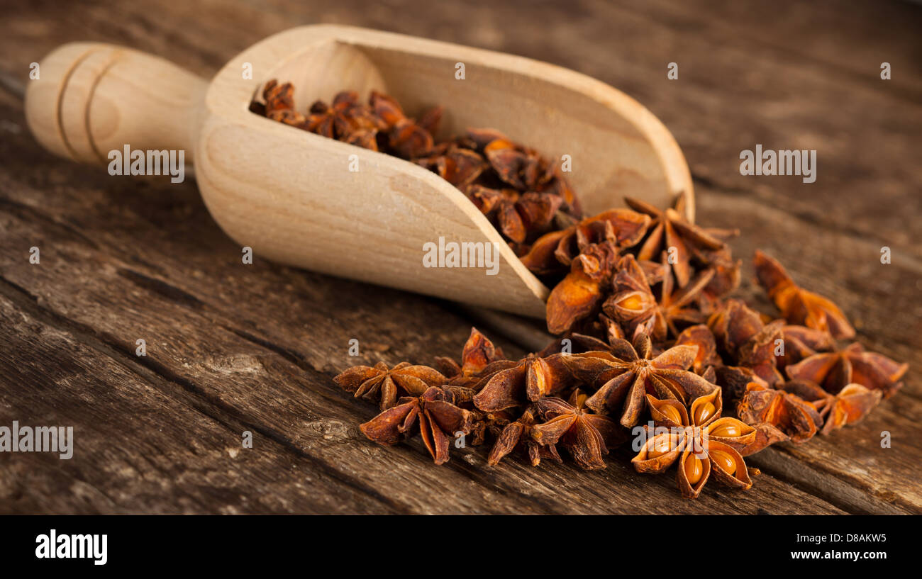 Stars anise on wooden table Stock Photo - Alamy