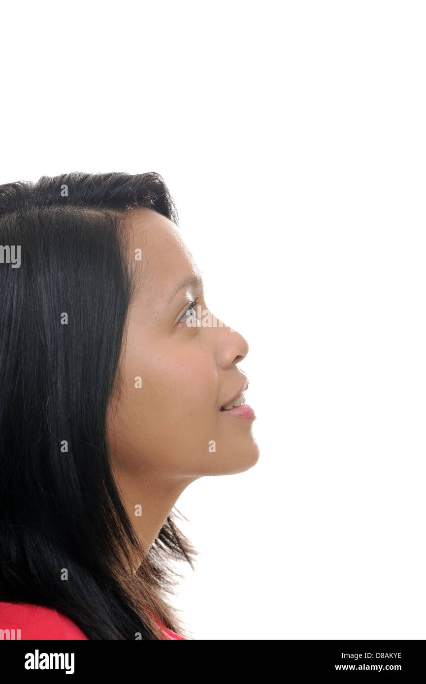 Asian girl looking up into white space Stock Photo - Alamy