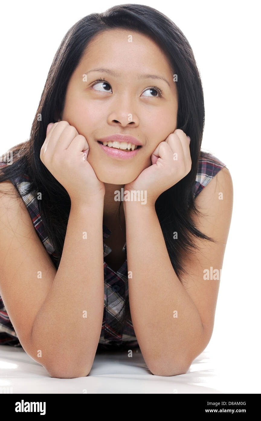 Asian girl looking friendly and smiling Stock Photo - Alamy