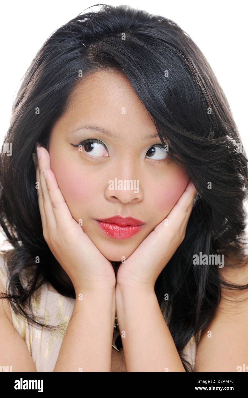 Asian female's face with makeup looking sideways Stock Photo - Alamy