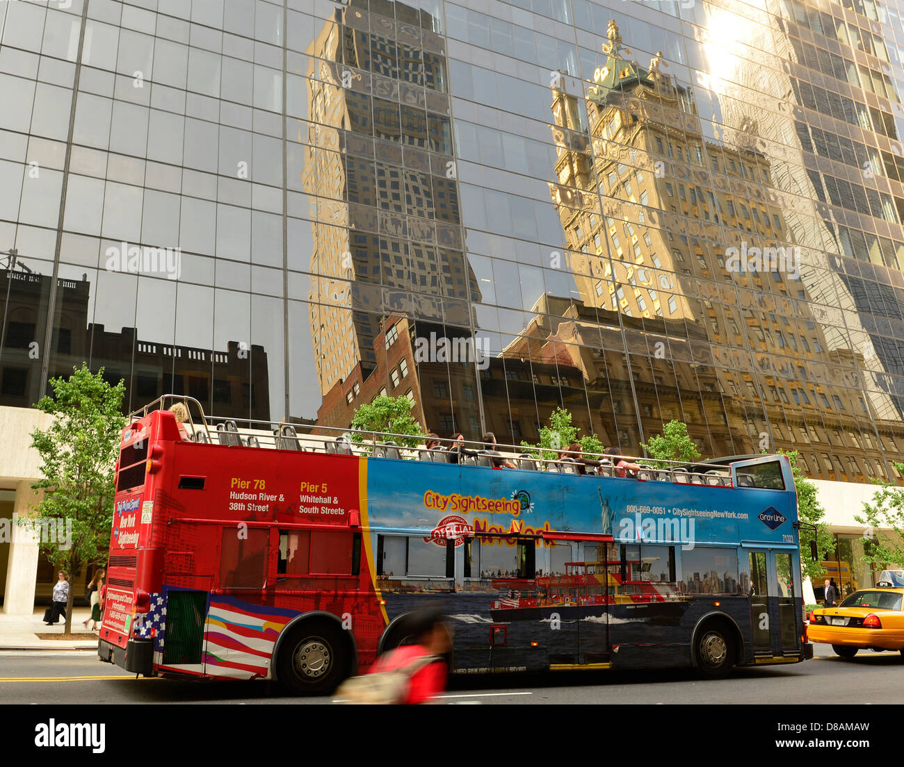 New York, USA. 21st May 2013. A colorful sightseeing bus passes by ...