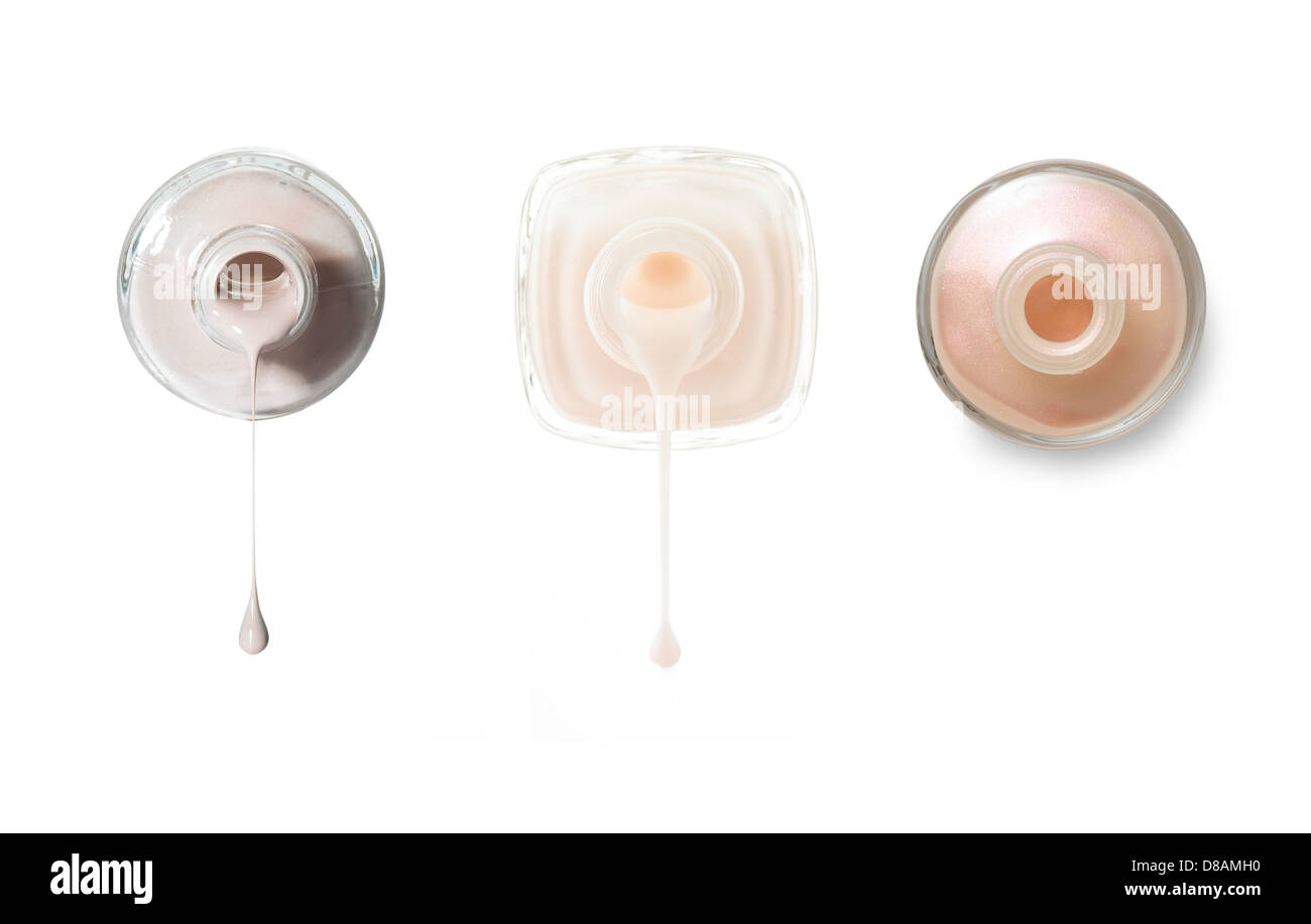 cream and beige nail polish pots with drip cut out onto a white ...
