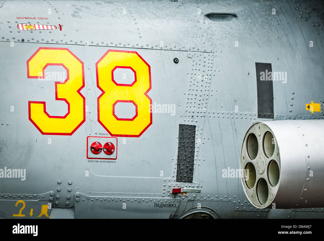 Side of helicopter with red and yellow drawn number 38 and text with ...