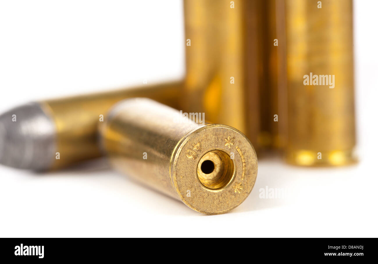 Heap of bullets on white background Stock Photo - Alamy