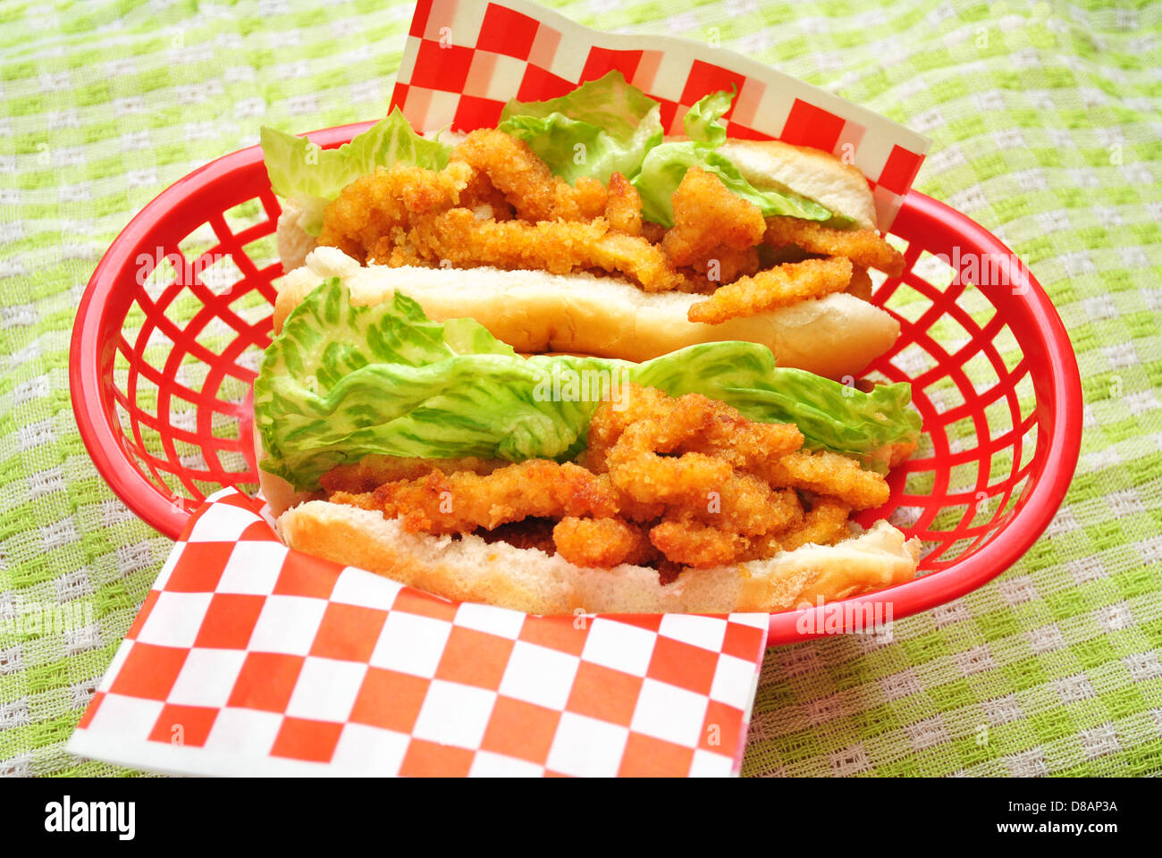 Two Clam Rolls Over a Green Background Stock Photo - Alamy