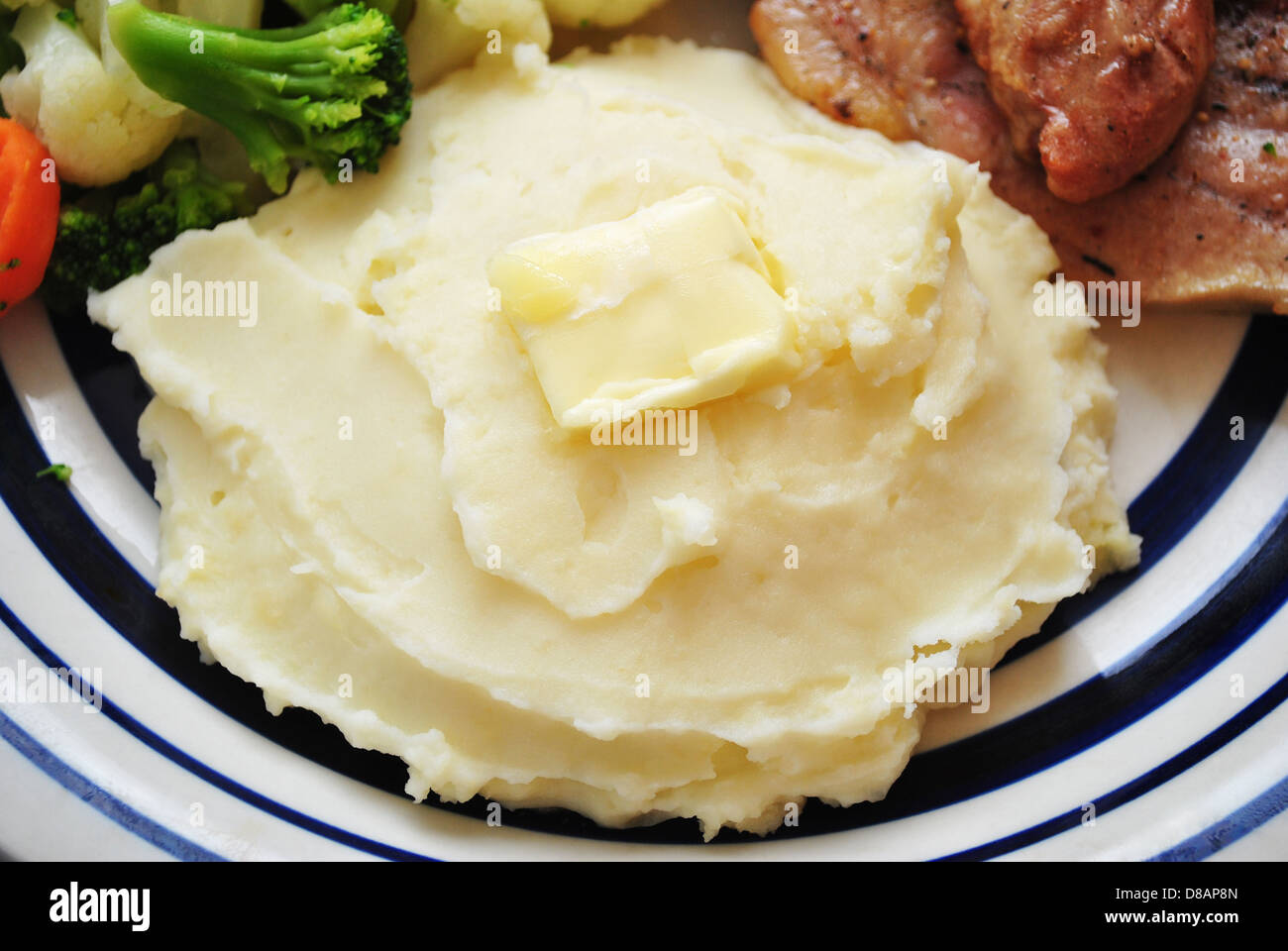 A Side Dish of Mashed Potatoes with Butter Stock Photo - Alamy