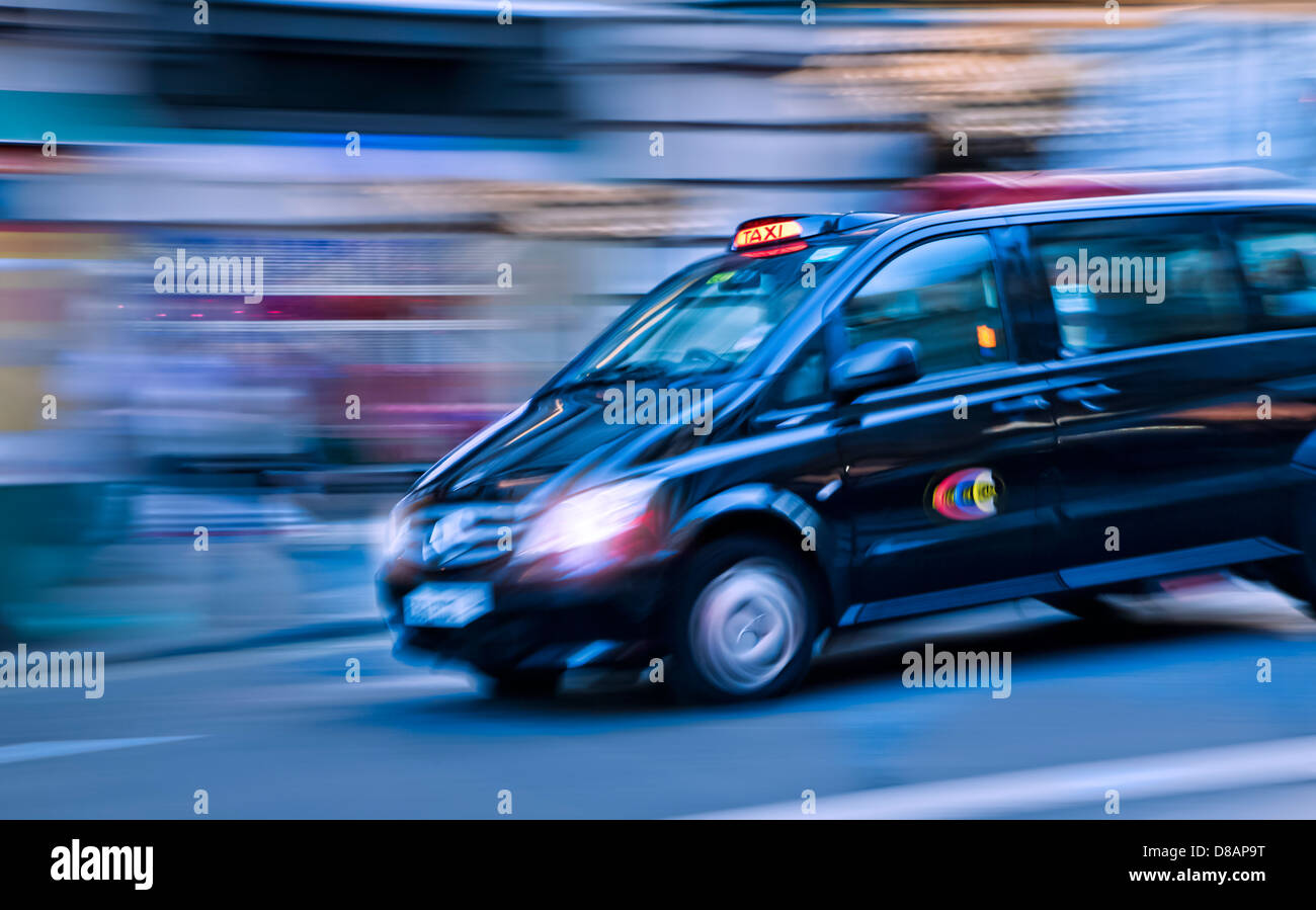 london taxi moving at speed in mayfair london uk Stock Photo - Alamy