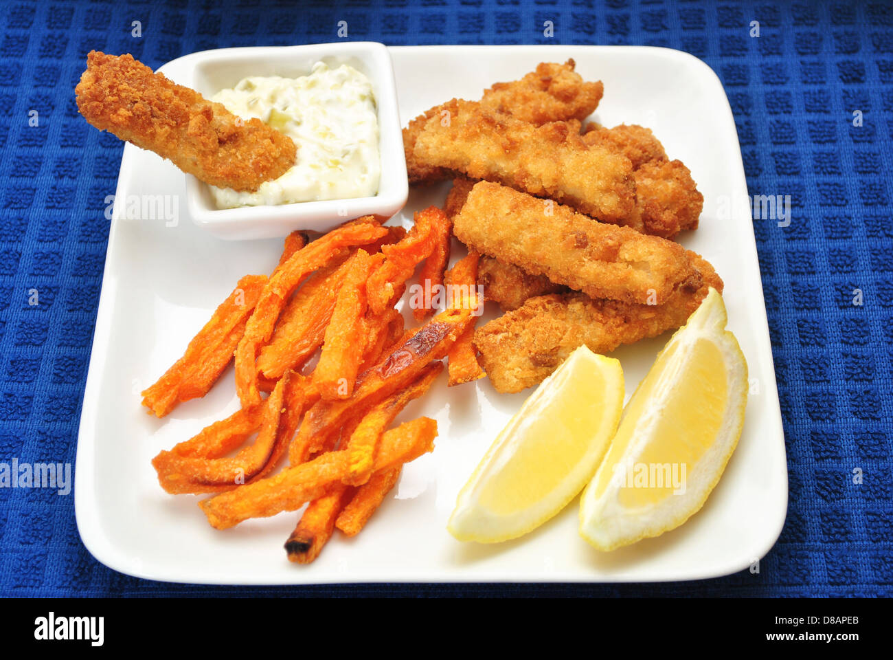 Baked Fish Stick Dinner with Tarter Sauce Stock Photo - Alamy