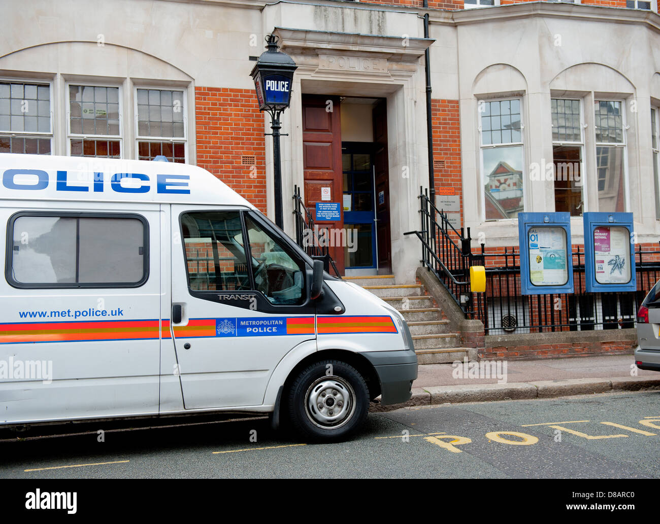 The police station at Woolwich in south east London with police van ...