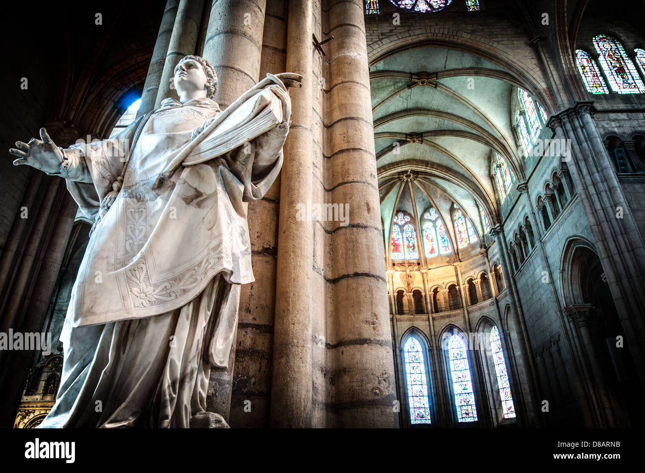 Interior of old catholic church in France, Europe. Statue of man and ...